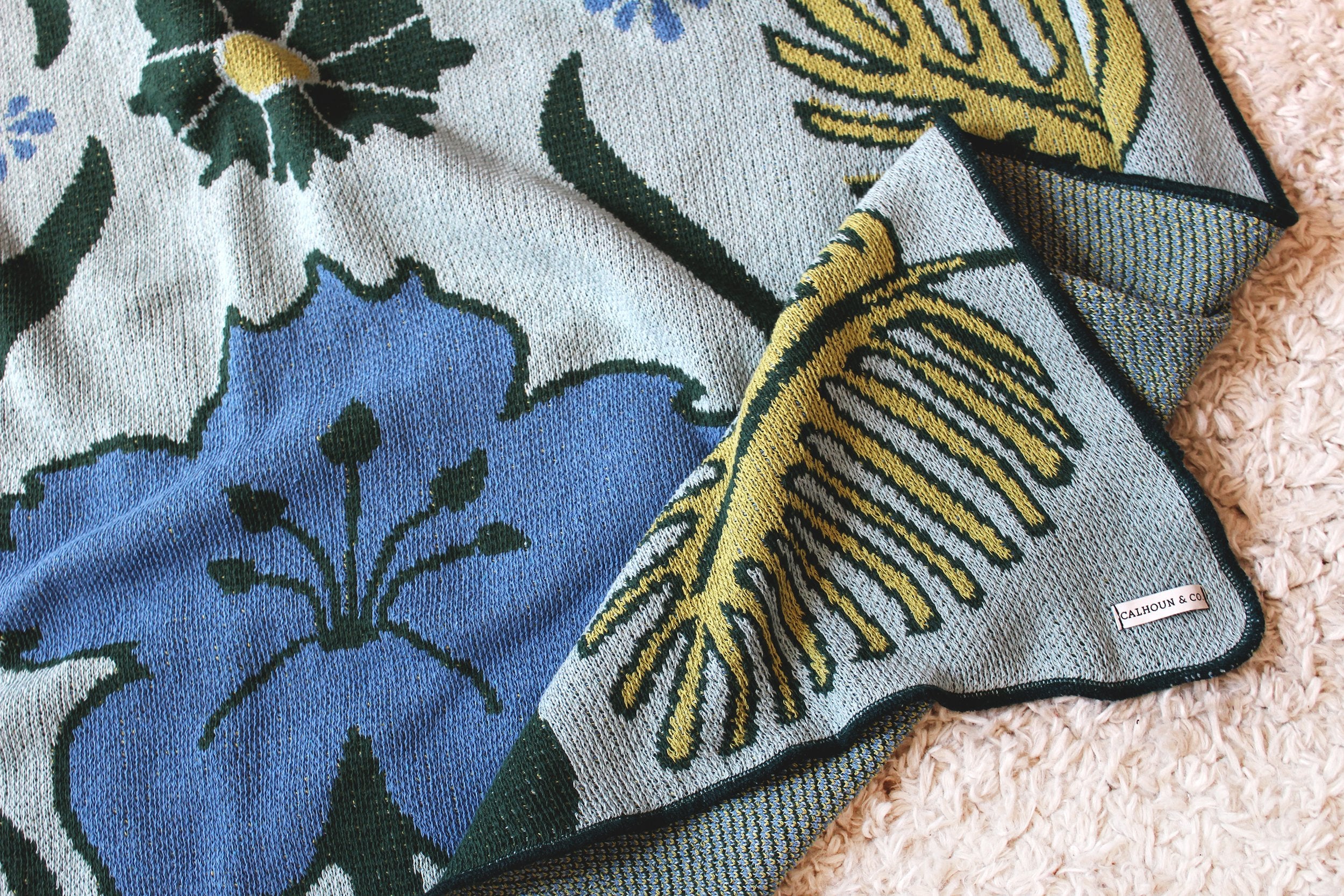 Tropical Art Deco Knit Blanket – Red Orchard